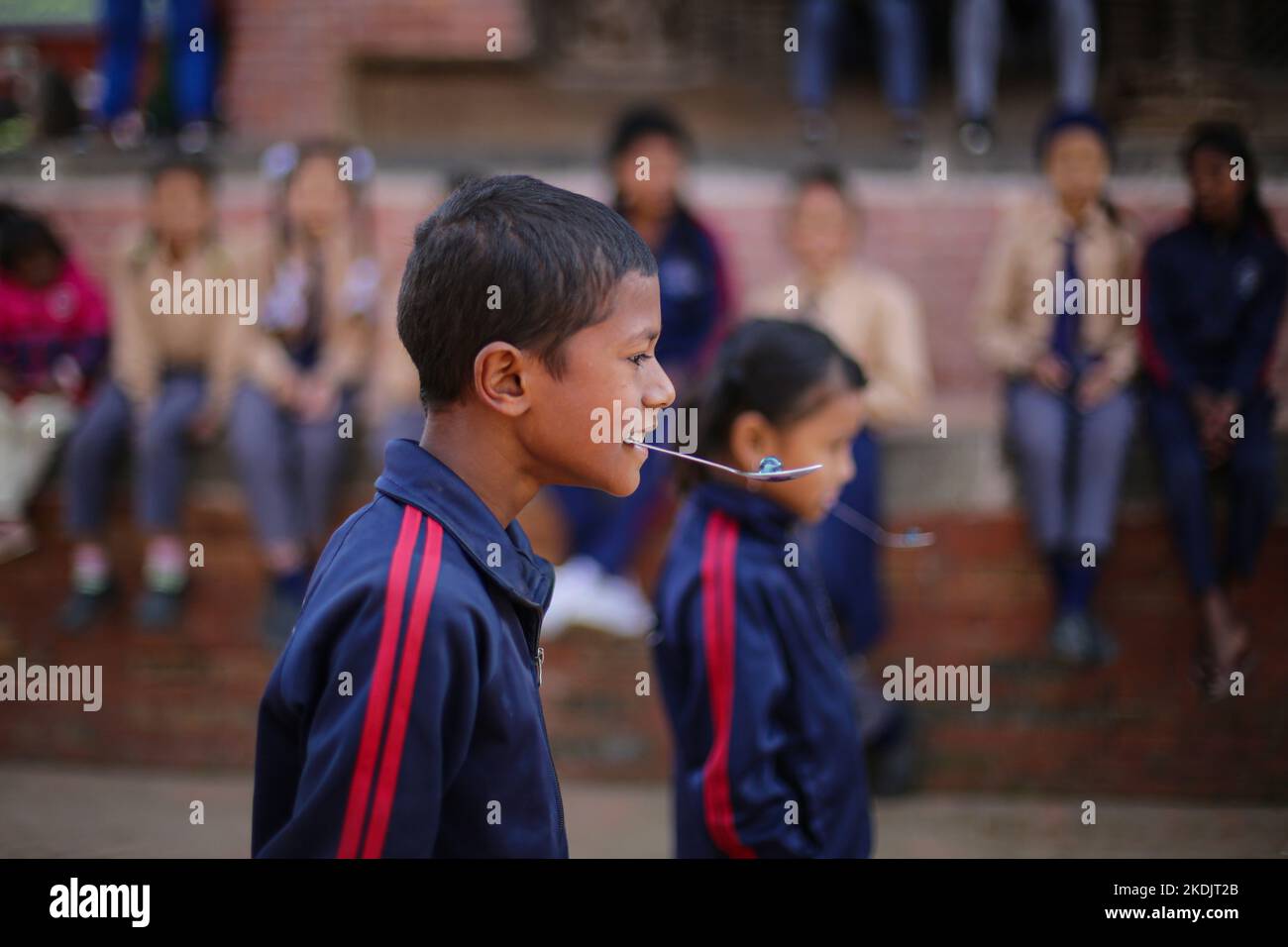 Nepal. 7th Nov, 2022. A group of students play ""˜Spoon and Marble ...