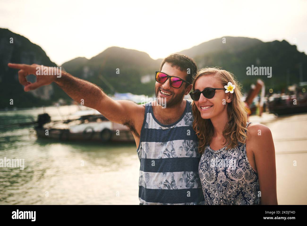 Checking out the sights on their beach stroll. a young couple enjoying ...