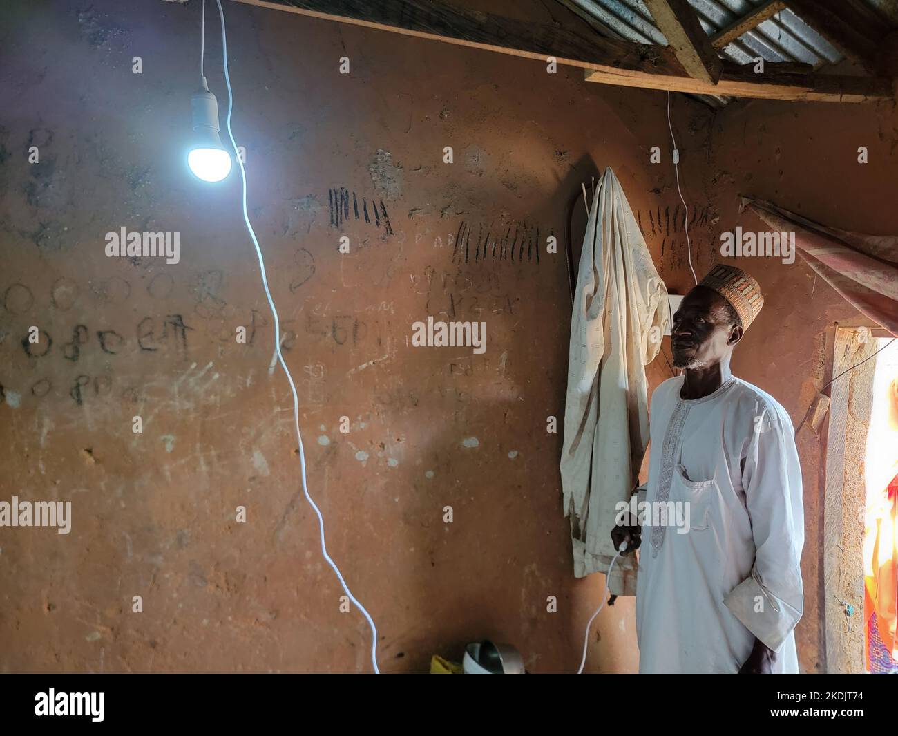 Kano, Nigeria. 5th Nov, 2022. A man switches on the solar light at home ...