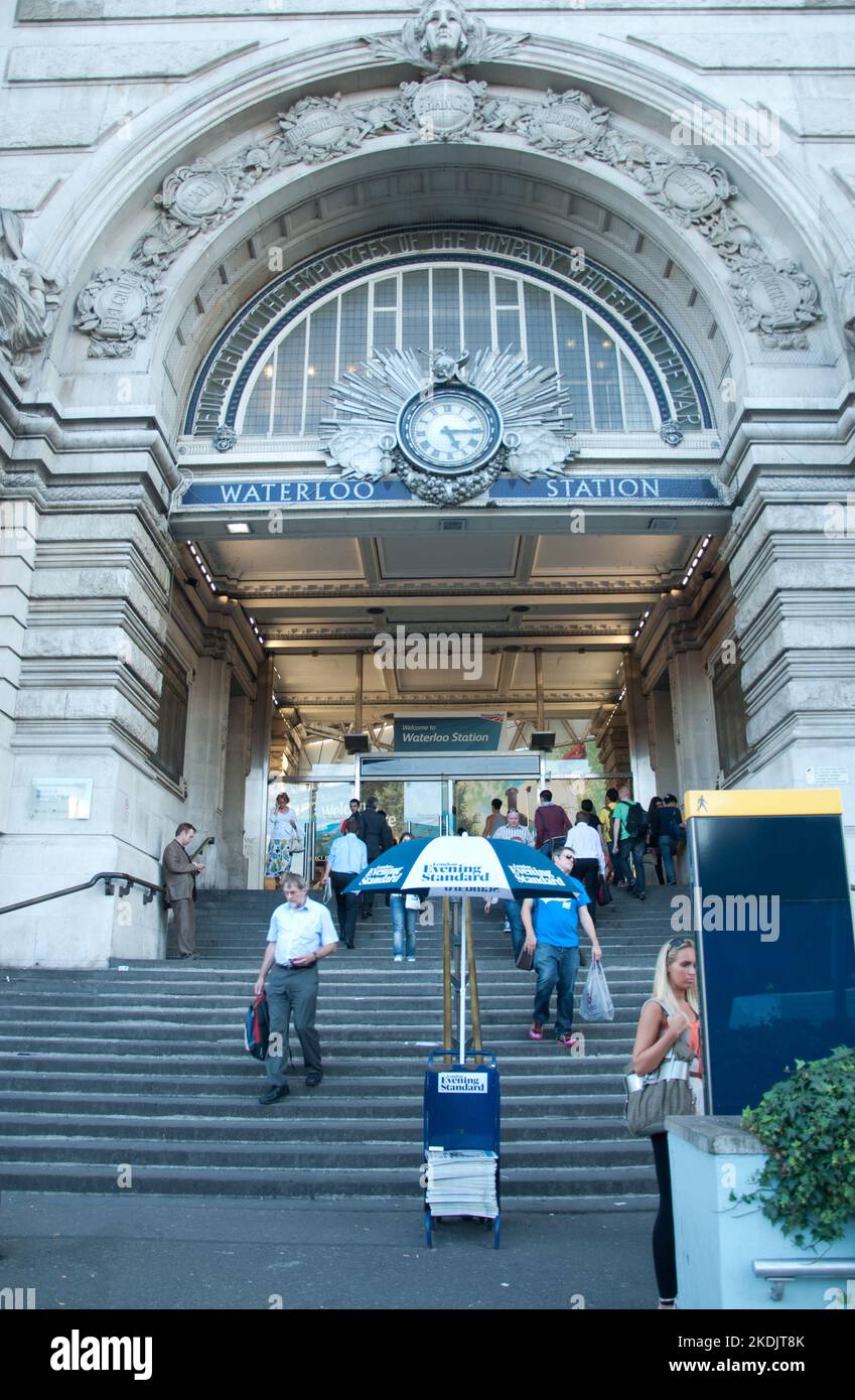 People entering and exiting Waterloo Station, Evening Standard stand ...