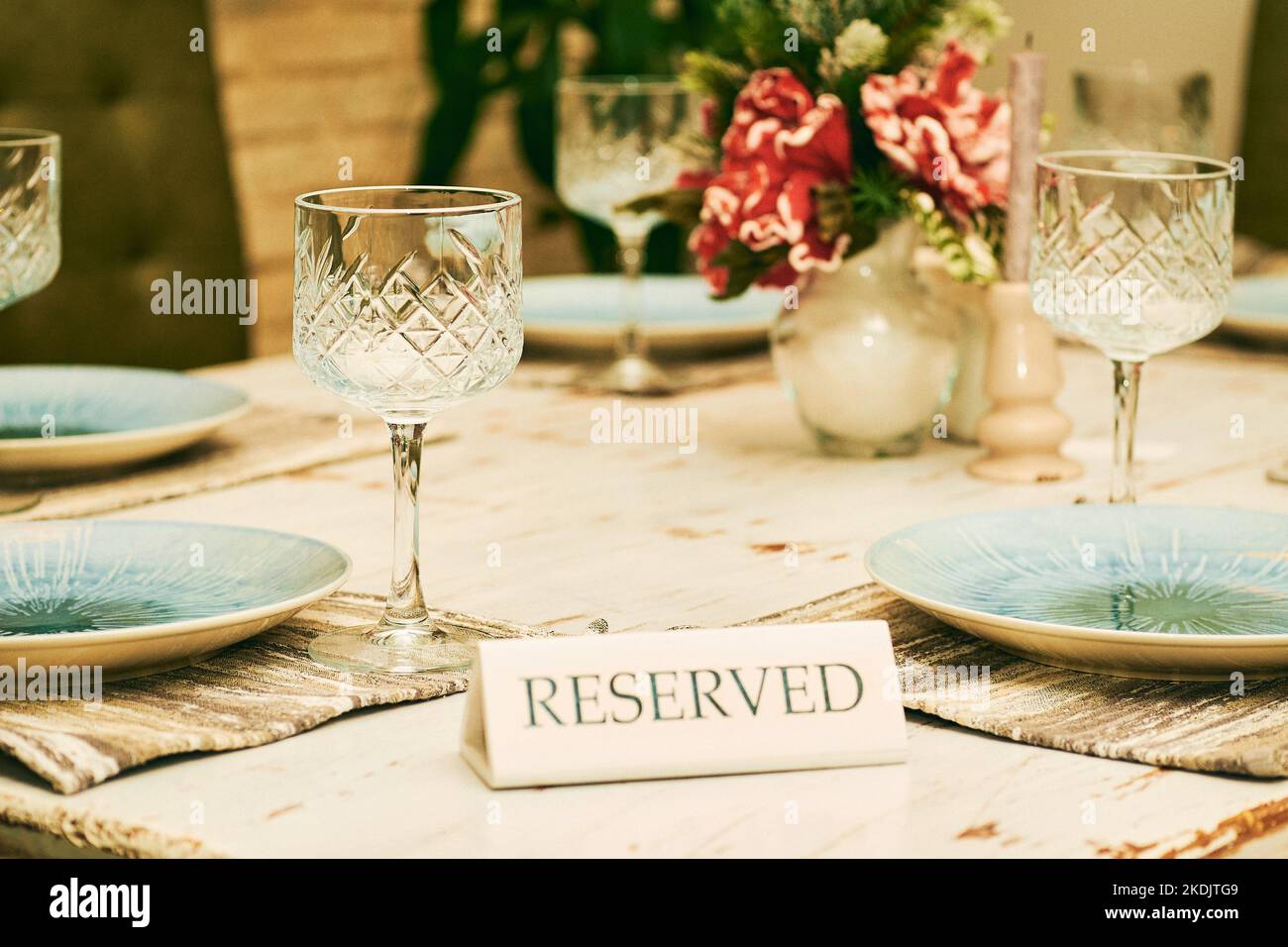 Reserved table in a cafe restaurant with wine glasses and plates Stock ...