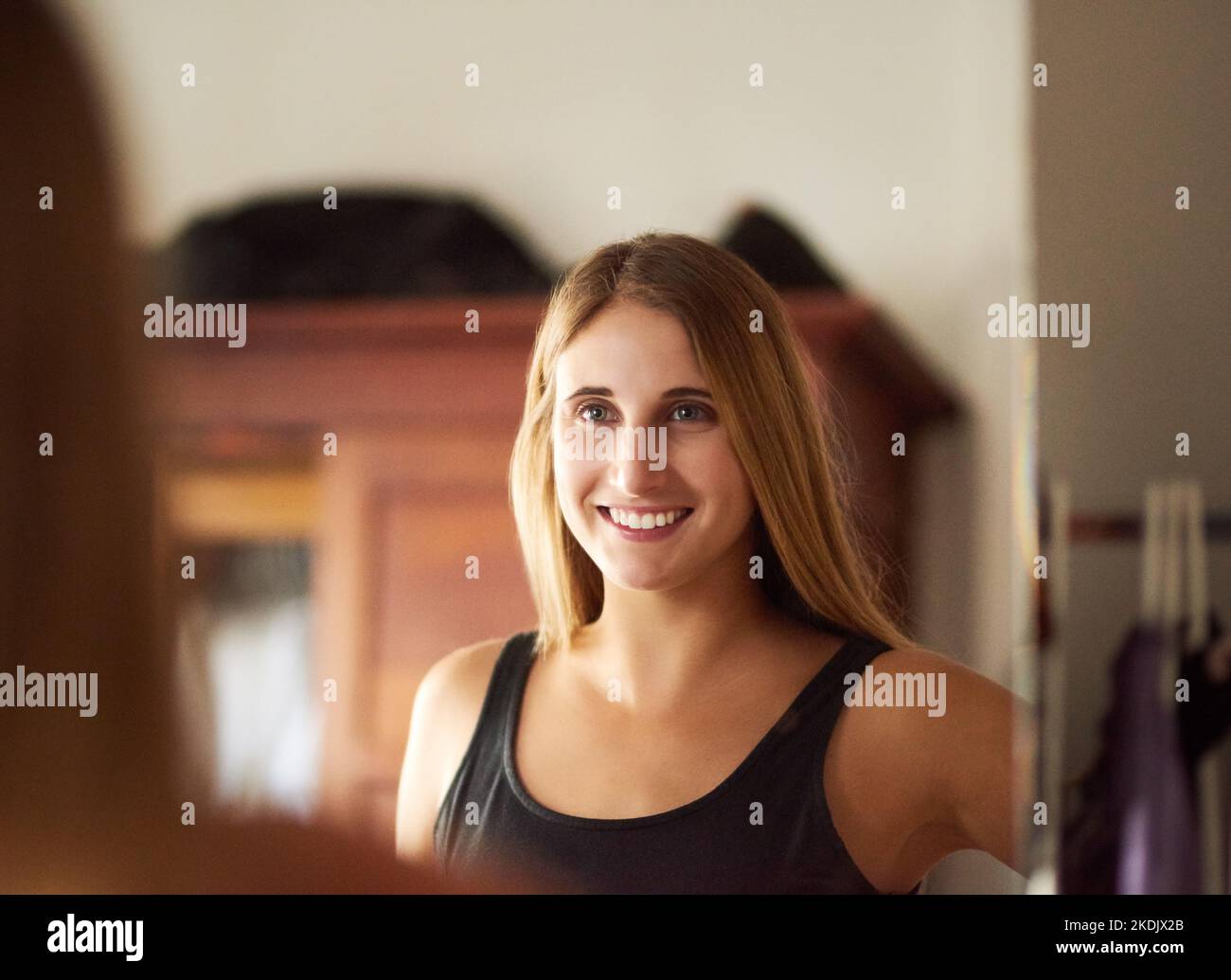 Woman getting dressed in bedroom hi-res stock photography and images ...