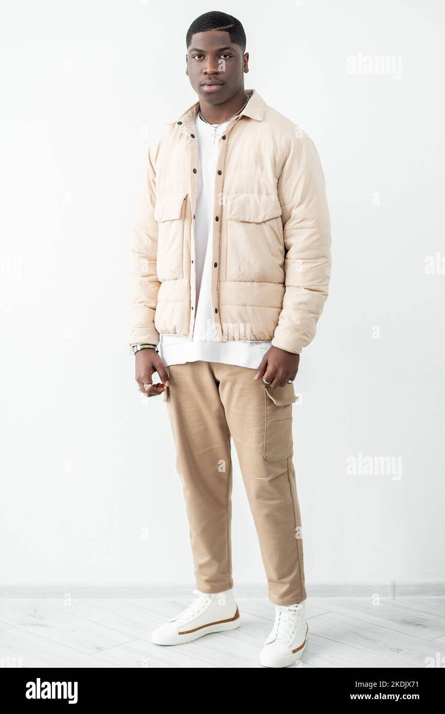 Tall handsome man portrait Trendy in beige outfit Stock Photo - Alamy