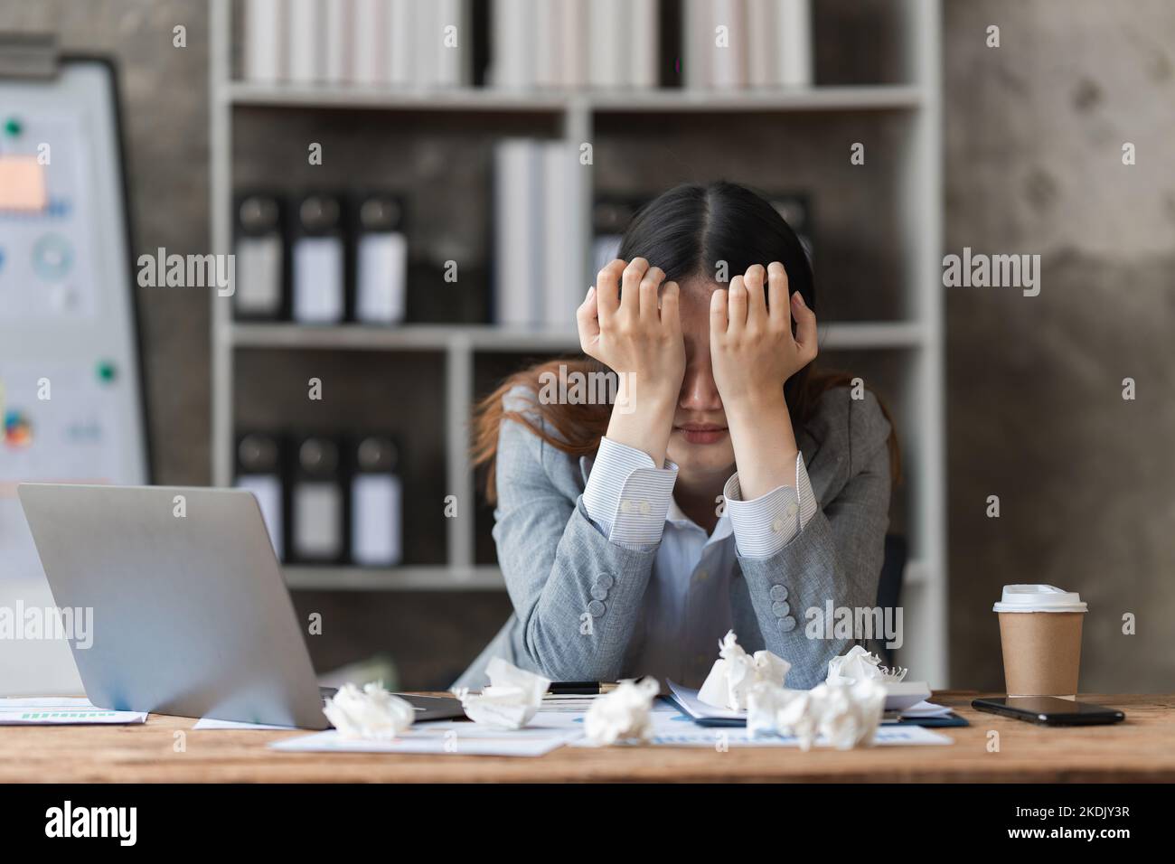 Stressed Asian business woman worry about marketing plan of this years ...
