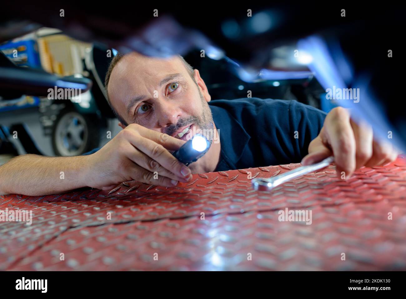 mechanic holding a torch Stock Photo - Alamy