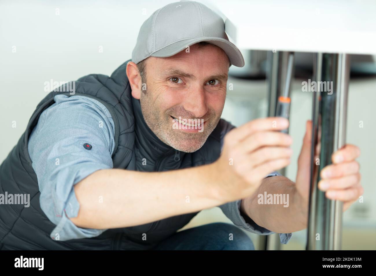 man repairing furniture at home Stock Photo - Alamy