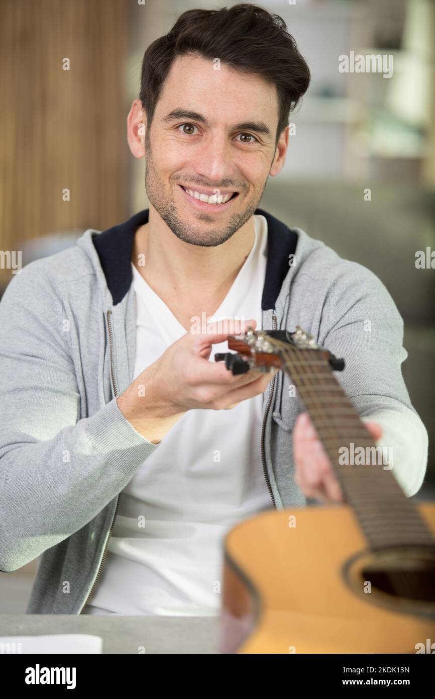 Checking guitar hi-res stock photography and images - Alamy