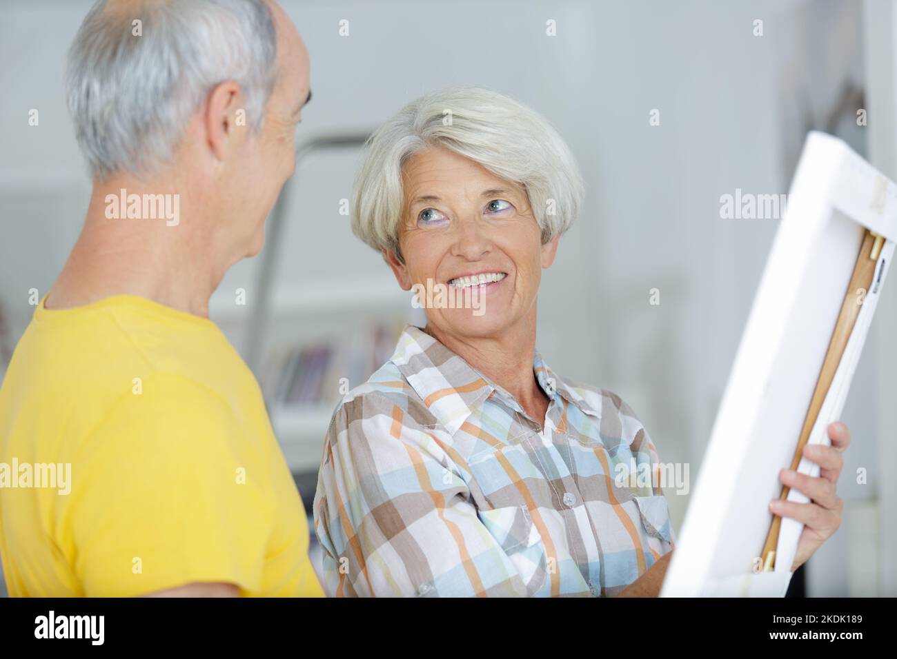elderly couple making diy choices Stock Photo - Alamy