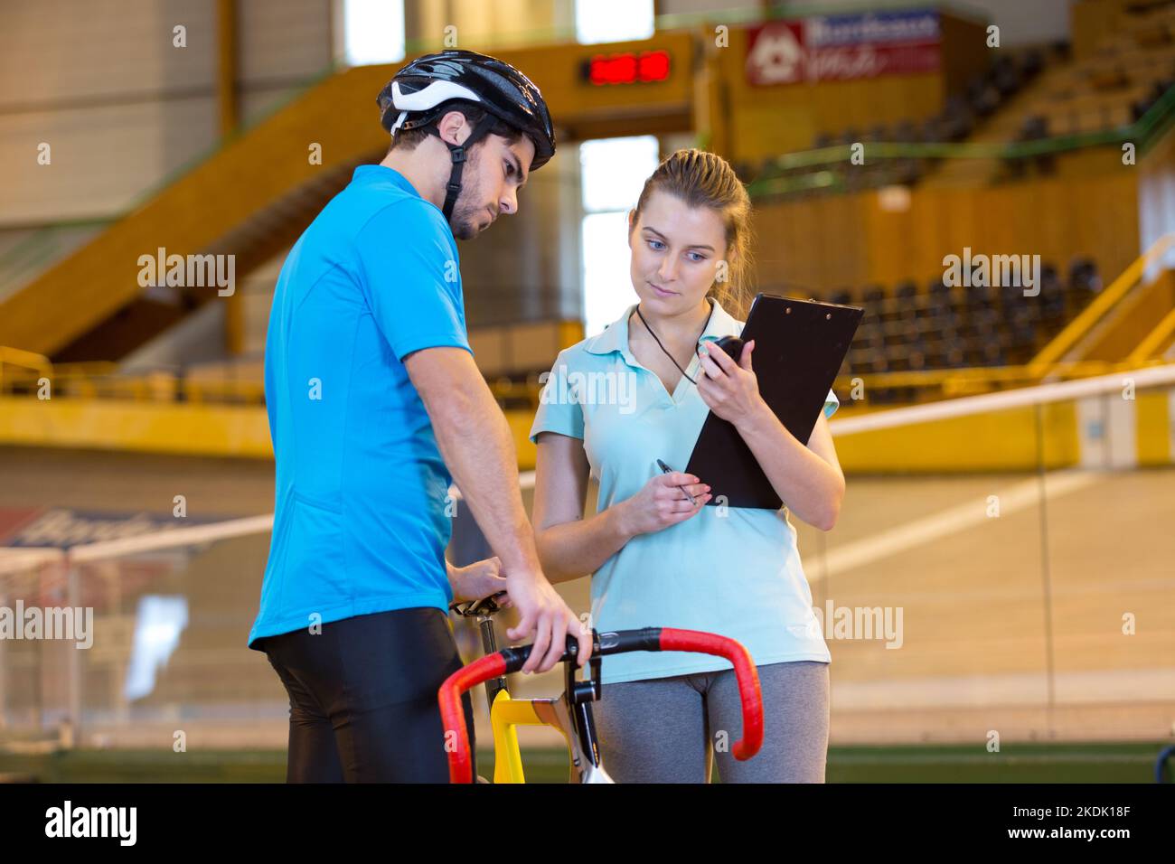 portrait of coach with male cyclist Stock Photo - Alamy
