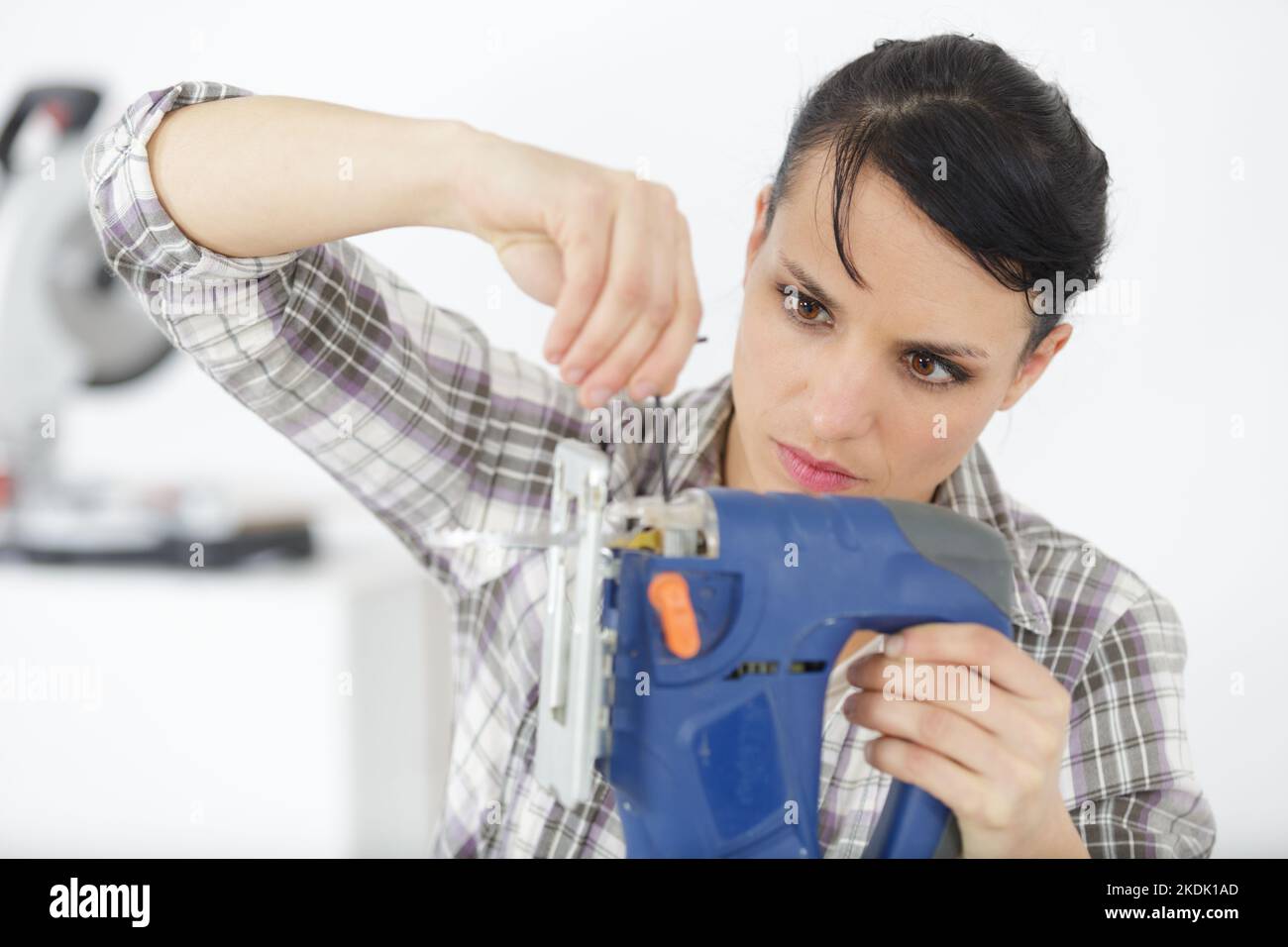 Woman man fixing object hi-res stock photography and images - Alamy