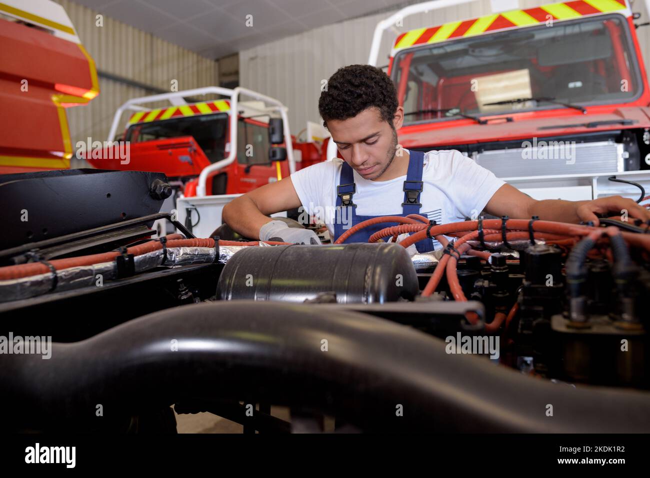 a man fixing an engine Stock Photo - Alamy