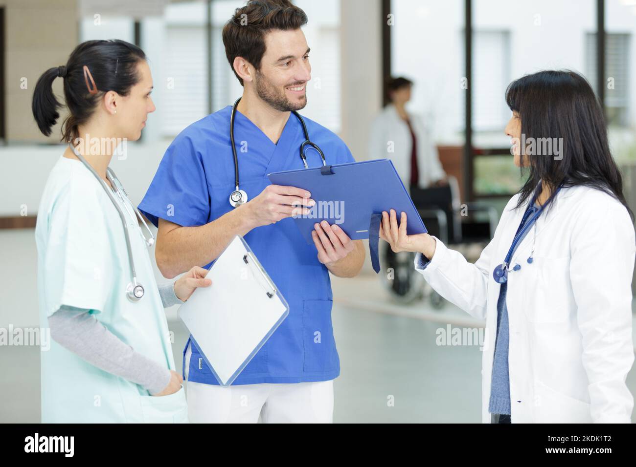 staff in busy lobby area of modern hospital Stock Photo - Alamy