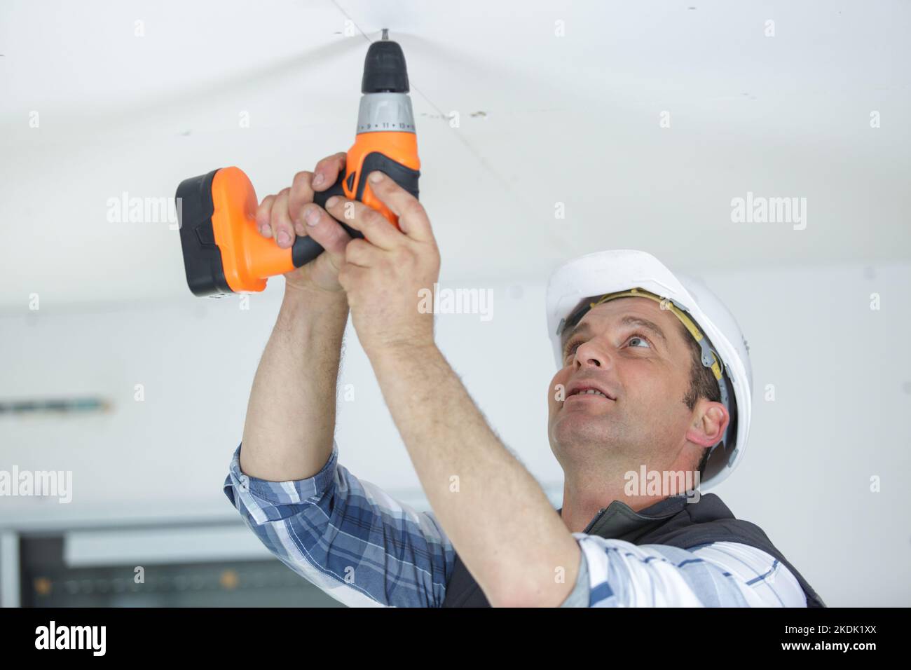 Ceiling drilling installation hi-res stock photography and images - Alamy