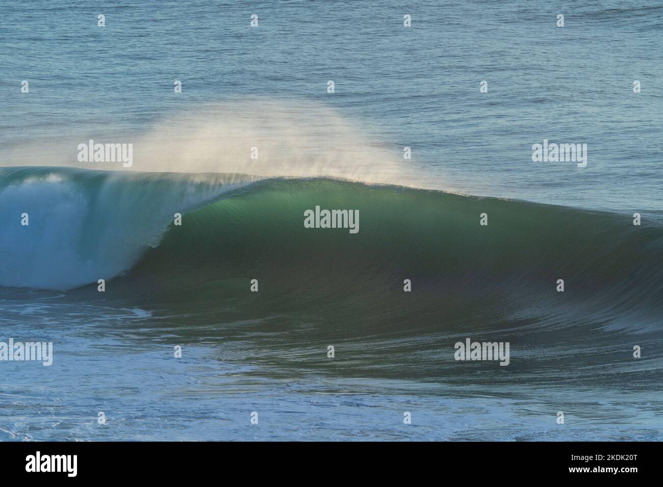 Perfect big wave breaking on a offshore wind bright sunny day on a reef ...