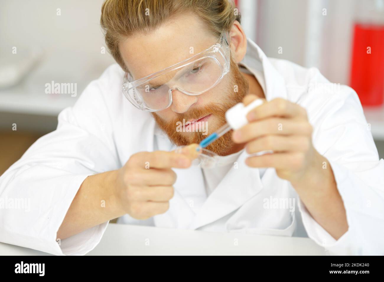 laboratory pipette with drop of liquid Stock Photo - Alamy