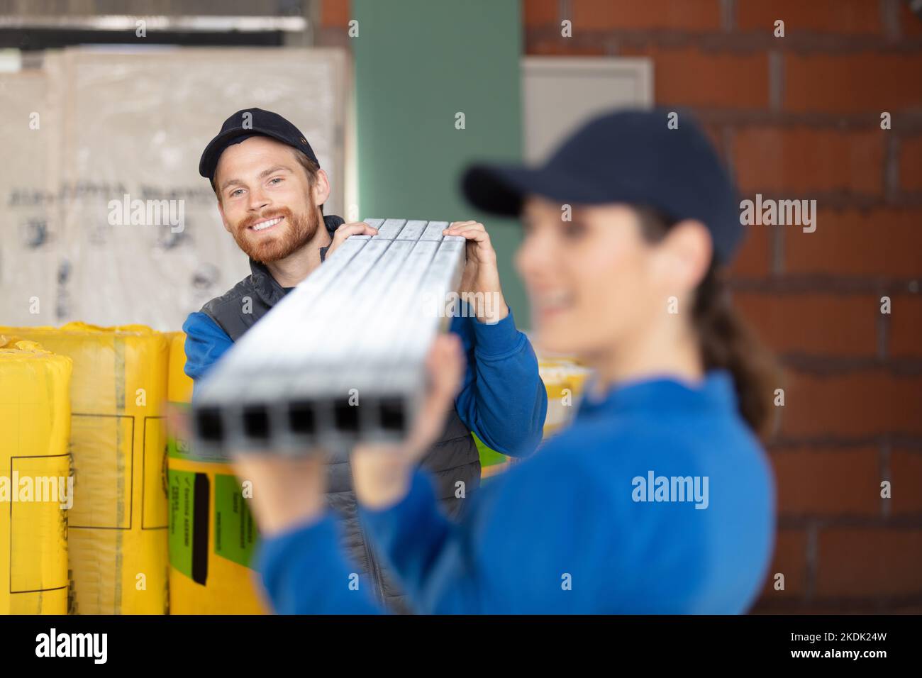 builder on building constuction site working together Stock Photo - Alamy