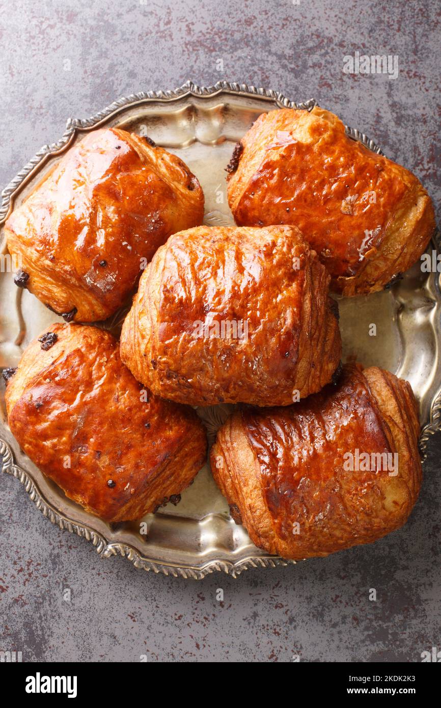 Pain au chocolat is a French viennoiserie roll made with a combination ...
