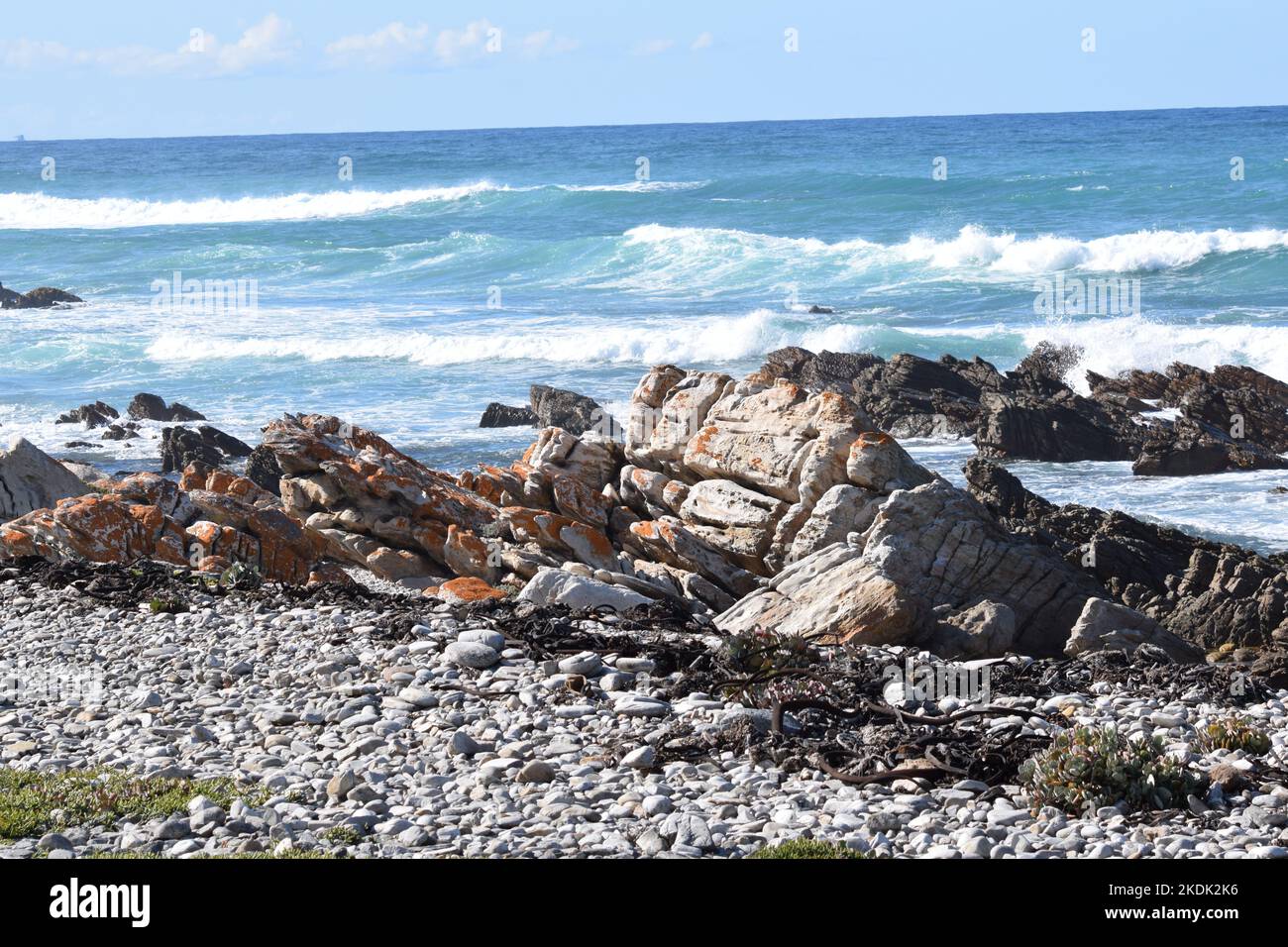 Rocky outcrop meets the ocean in Agulhas National Park Stock Photo - Alamy