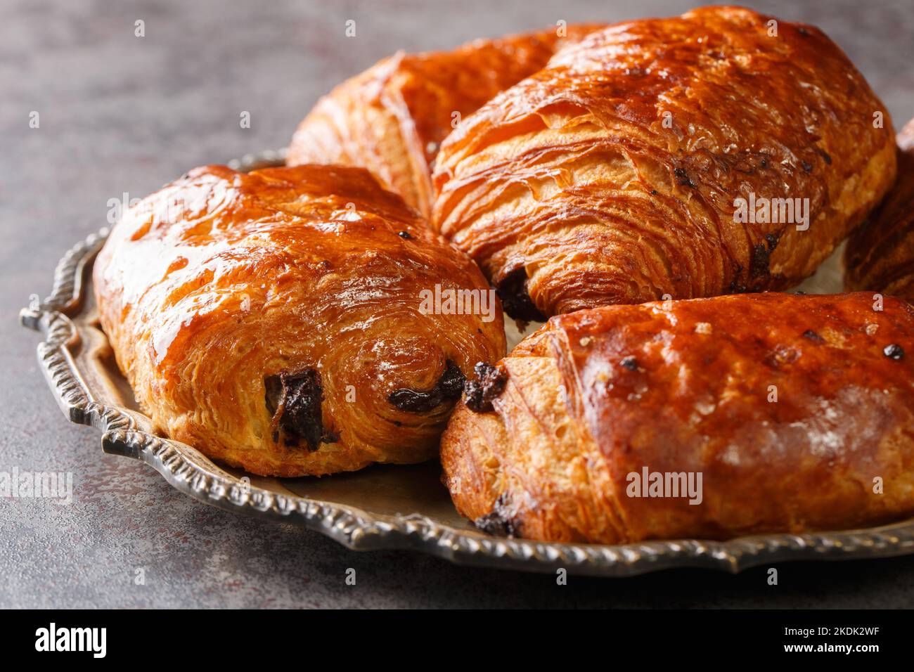 Homemade Chocolate Croissants Pain au Chocolat closeup in the plate on ...