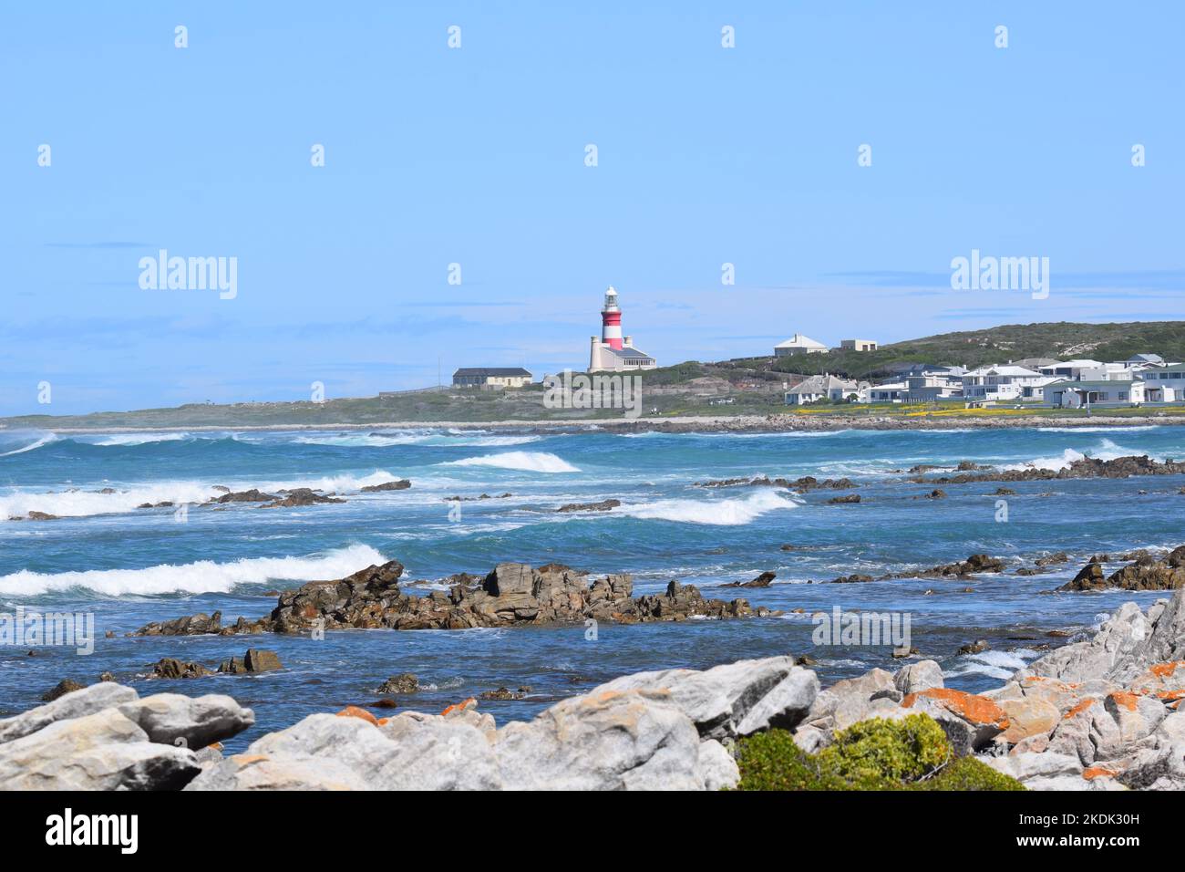Lighthouse overlooking the treacherous rocks Stock Photo - Alamy
