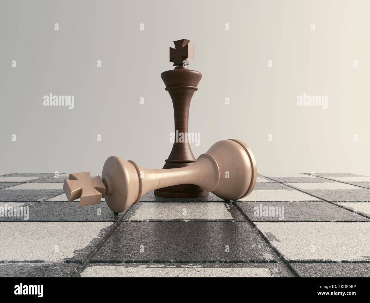 A dark wooden chess king standing over the fallen light wood king on a ...