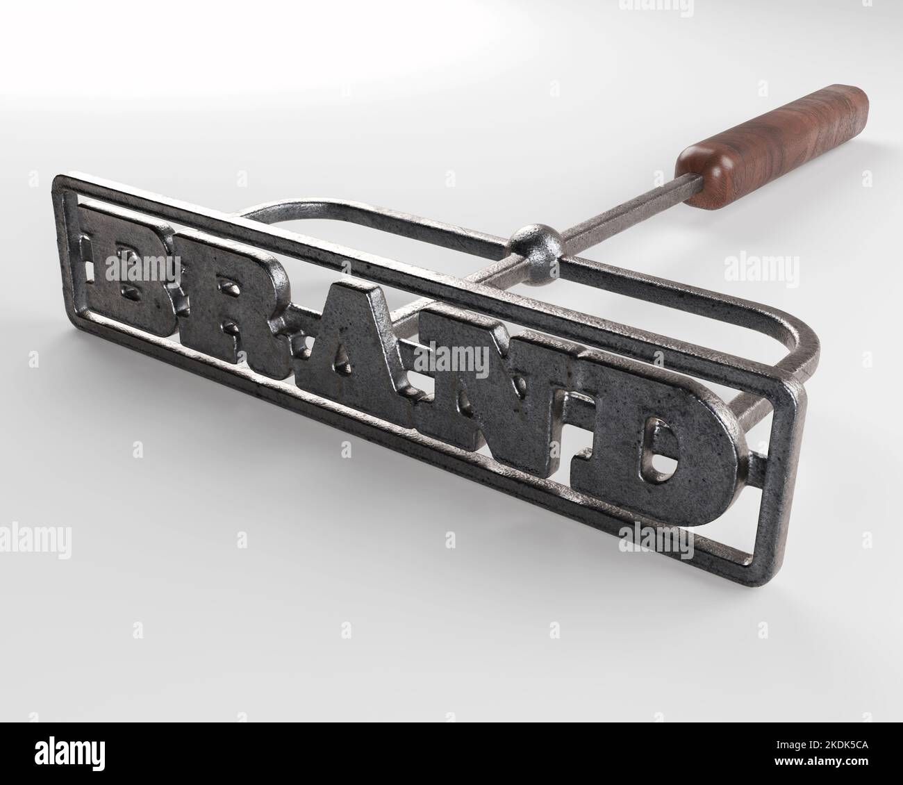 A metal cattle branding iron with the word brand as the marking area on ...