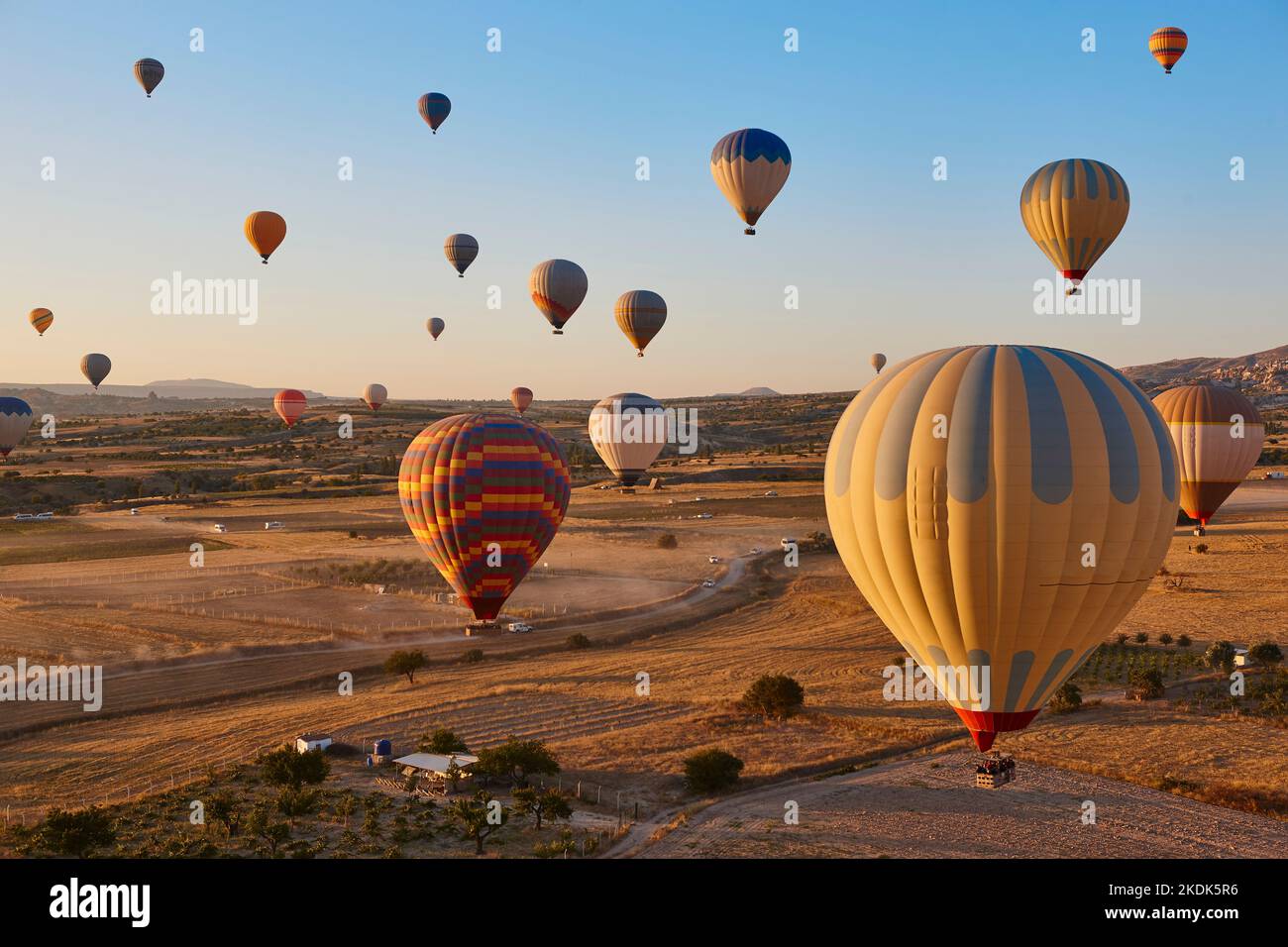 Balloons at dusk in Cappadocia. Spectacular flight in Goreme. Turkey ...