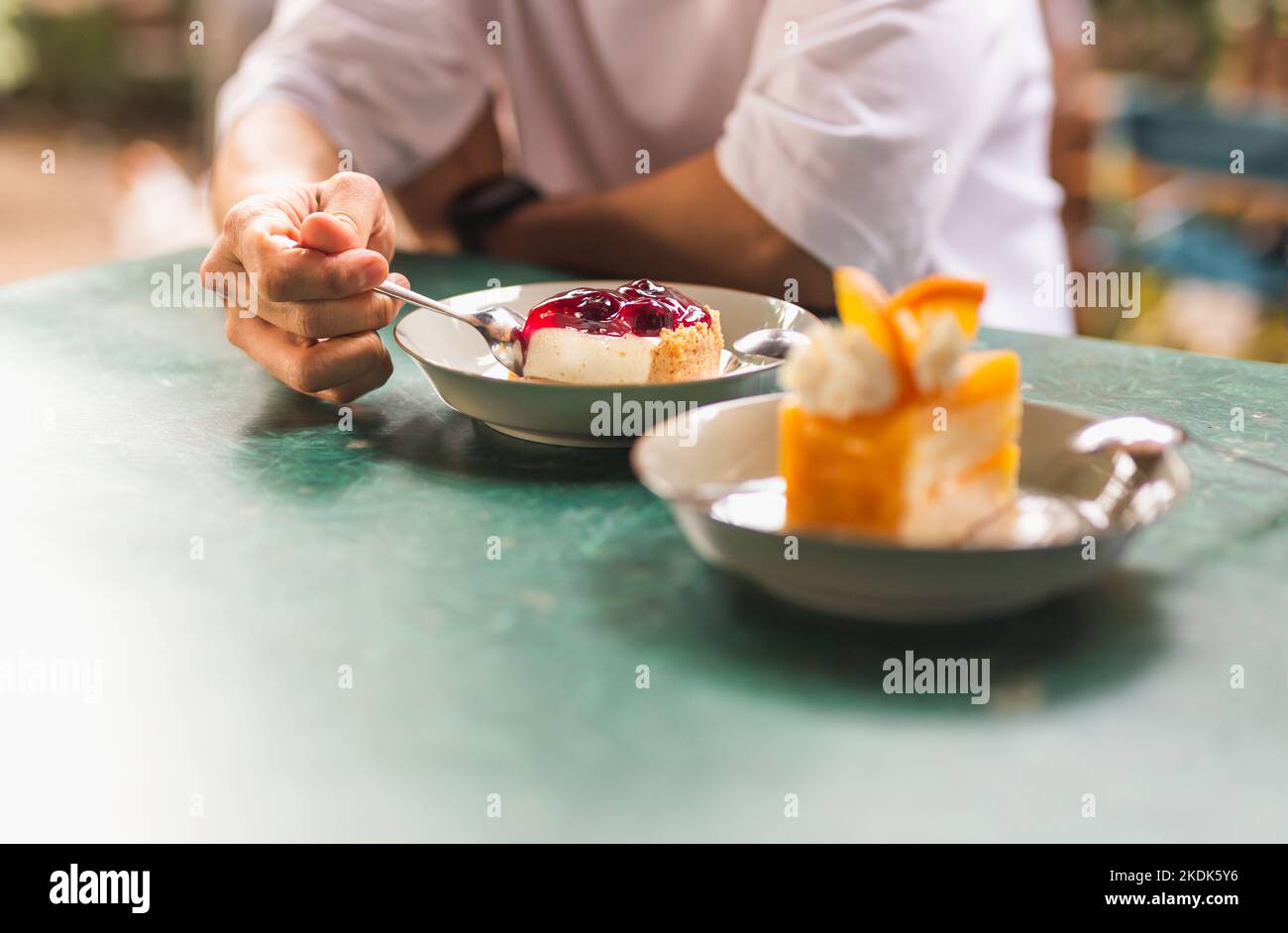 Fat man eating cream cake hi-res stock photography and images - Alamy
