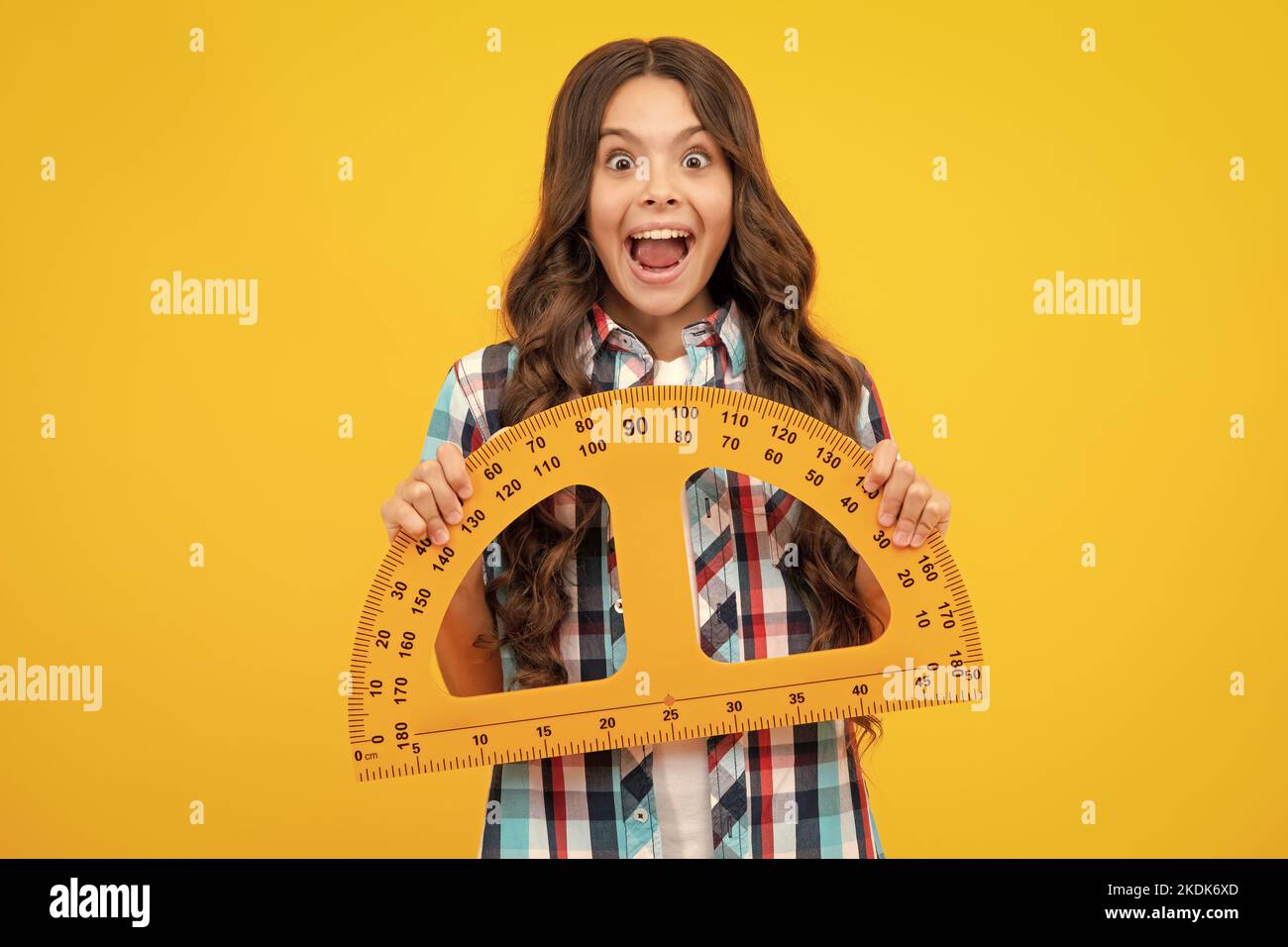 Amazed teen girl. Teenager child school girl holding measure for ...