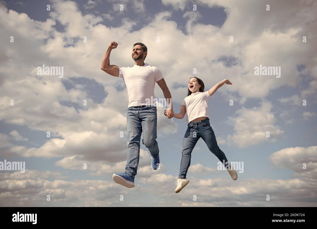 happy father and daughter jump in sky. freedom Stock Photo - Alamy