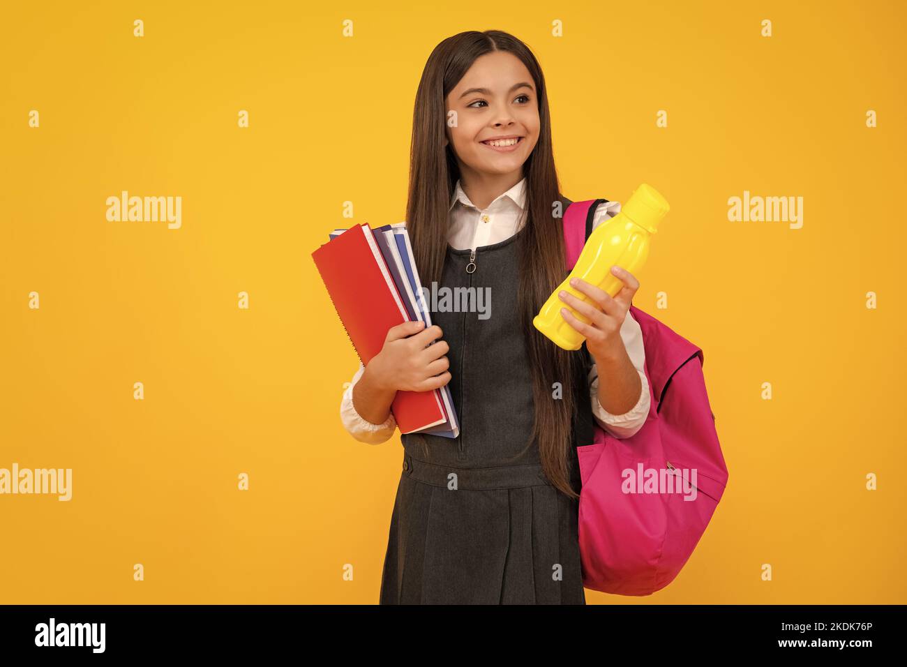 Teenager schoolgirl with backpack holding water bottle isolated on ...