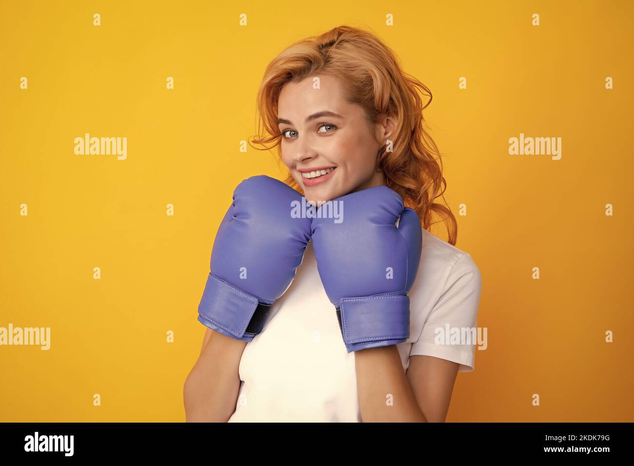 Happy smiling portrait of beauy woman in boxing gloves. Winning success ...
