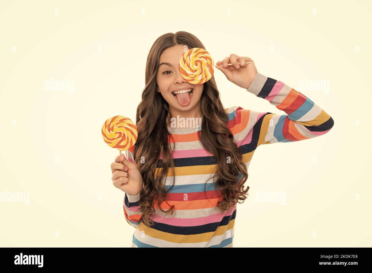 making faces. happy girl hold lollipop isolated on white. lollipop ...