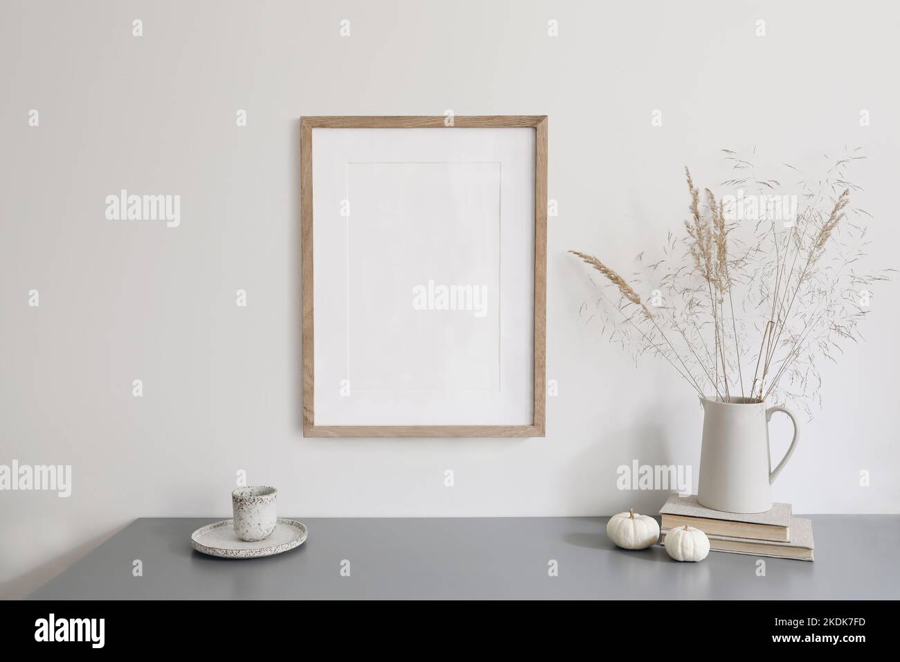 Autumn breakfast still life scene. ceramic jug with dry grass, cup of ...