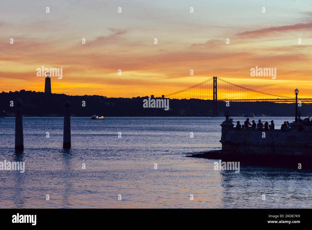 People enjoying the sunset view over the Tagus river in Lisbon Stock ...