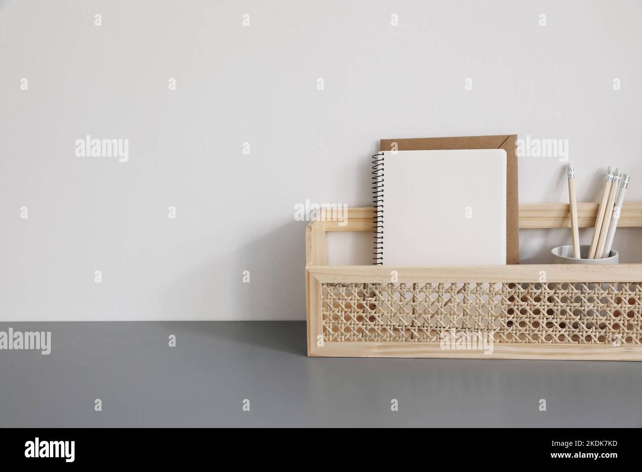 Neutral boho wokspace, still life. Pencils in ceramic holder and blank ...