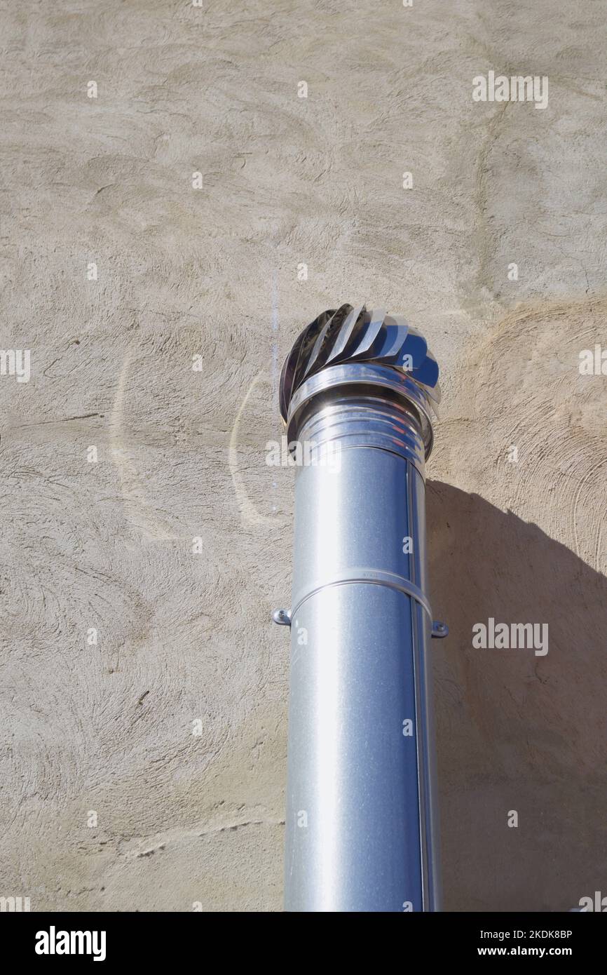 Image of a vent located next to a tall building and extracting hot air ...