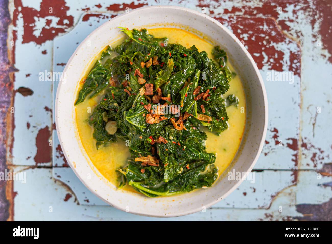 Gulai Daun kale / kale cooked with coconut milk and spices Stock Photo ...