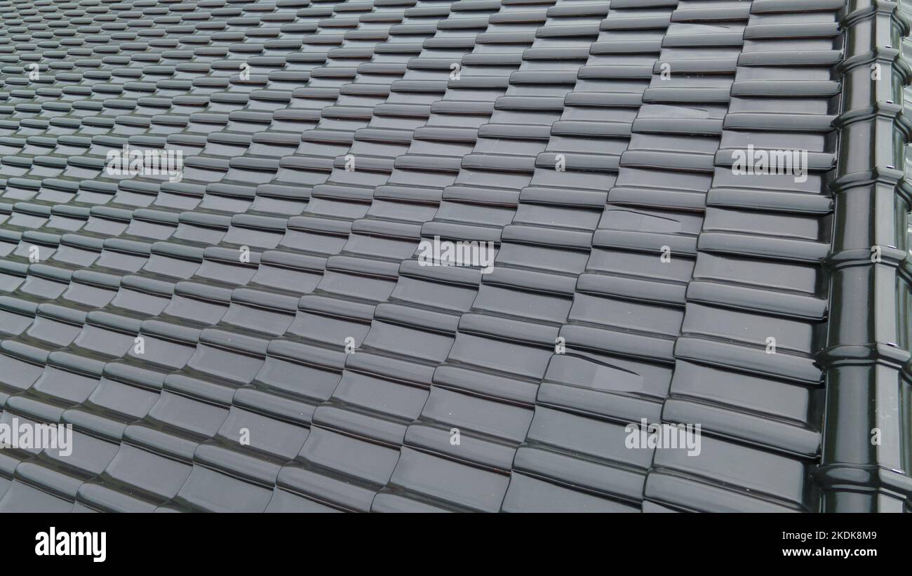 Close up of black, burnt roofing on the roof, construction and building ...