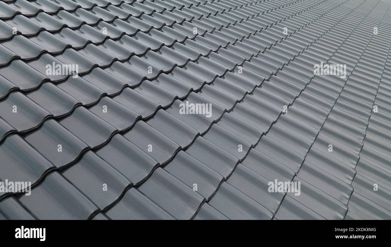 Close up of black, burnt roofing on the roof, construction and building ...