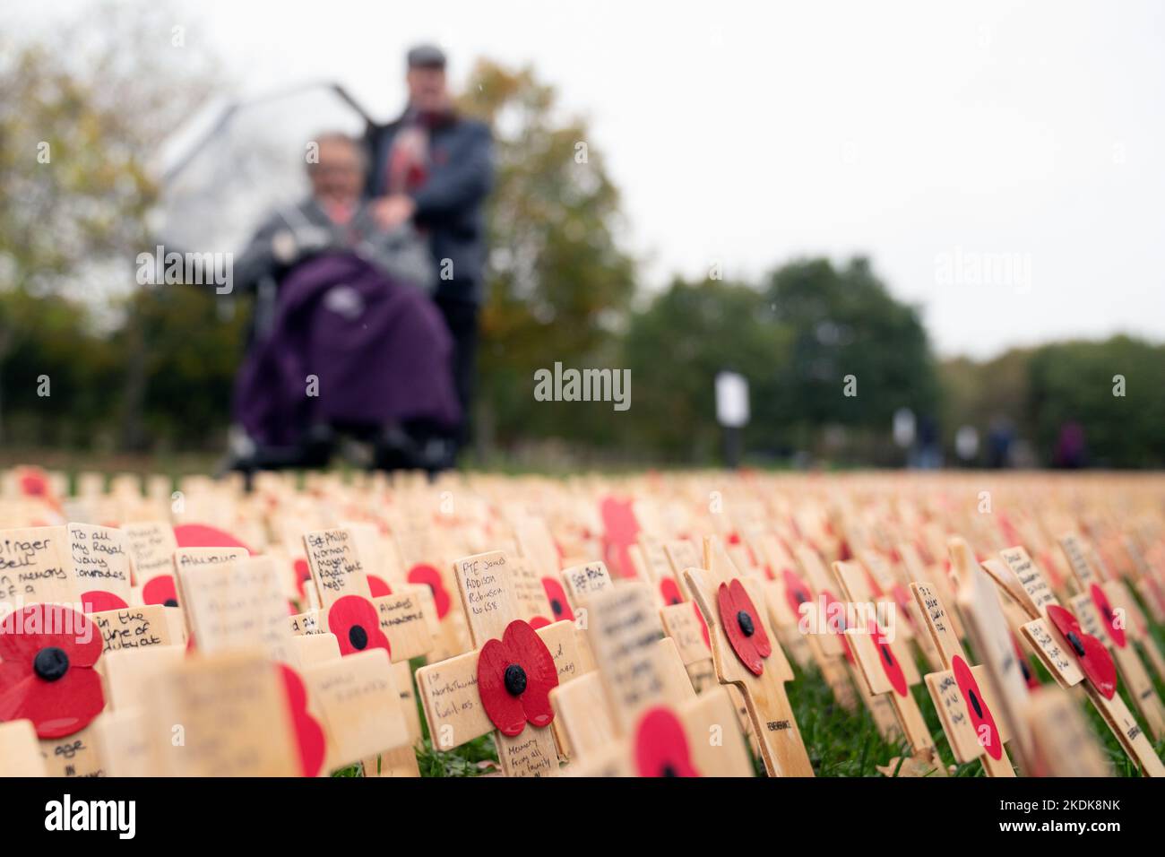 Ron and Barbara Fisher read messages written on planted tributes during ...