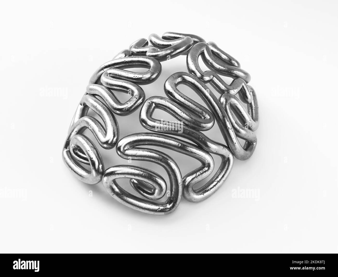 A metal casting depicting a stylized brain on an isolated background ...