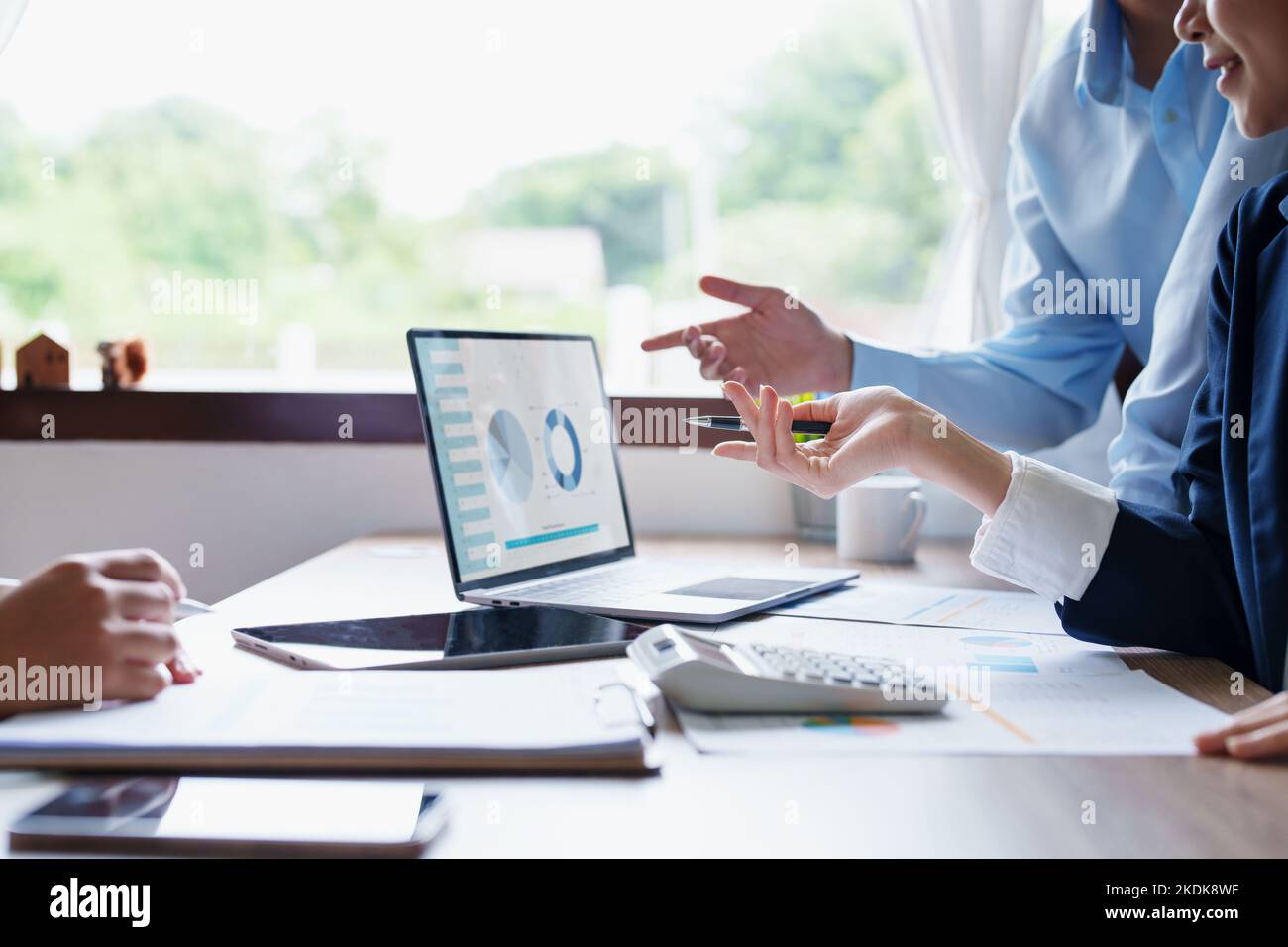 Group business use calculators, documents, computers to analyze work ...