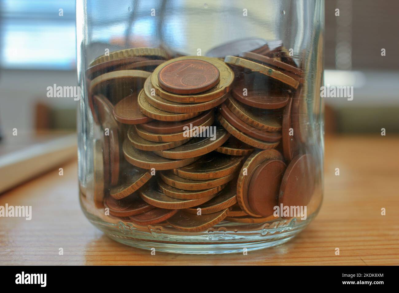 my half full savings glass jar to fight inflation Stock Photo - Alamy