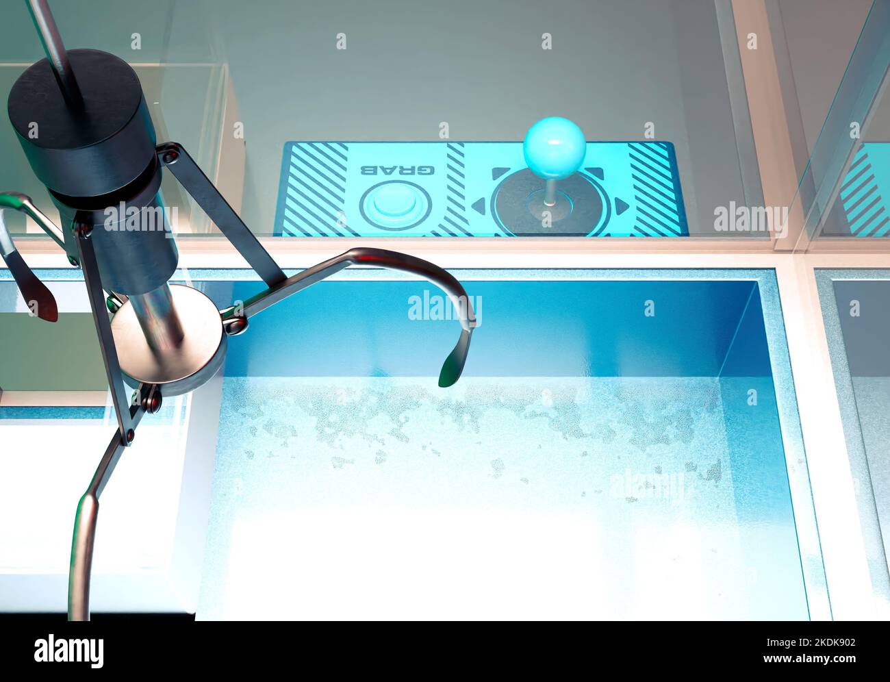 An empty arcade type claw grabber game on an isolated colorful ...