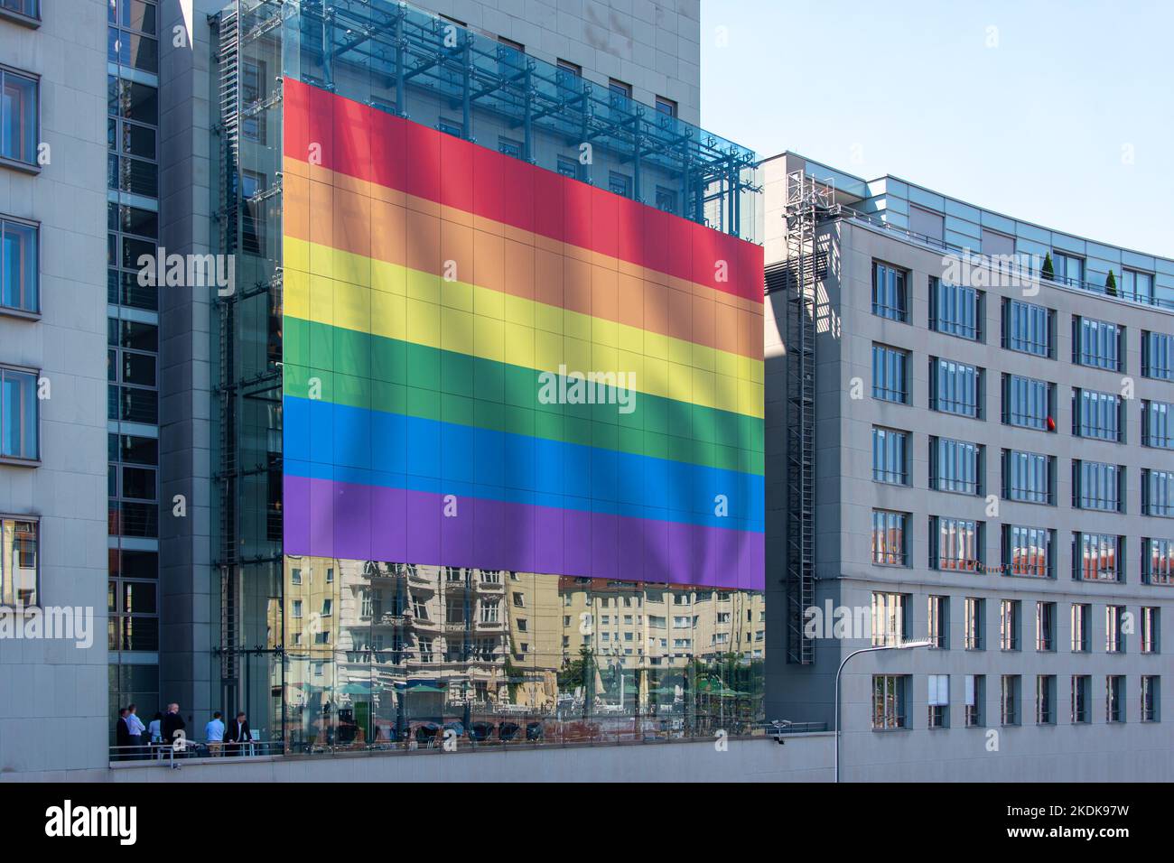 Giant LGBT flag on the huge screen on the building wall. Pride Flag ...