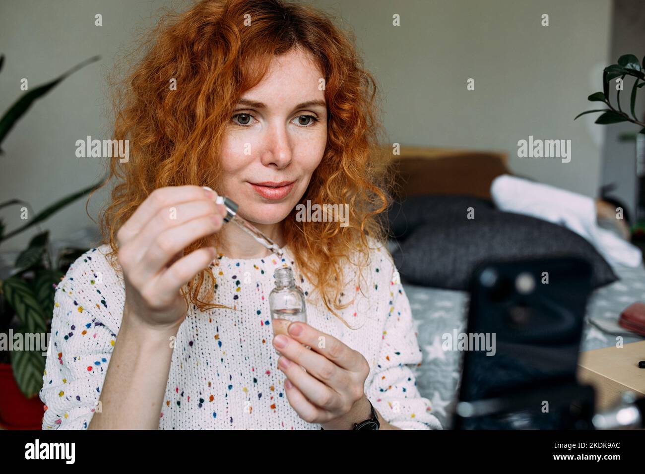 Young Curly Redhead Female Blogger Filming Daily Tutorial For Social