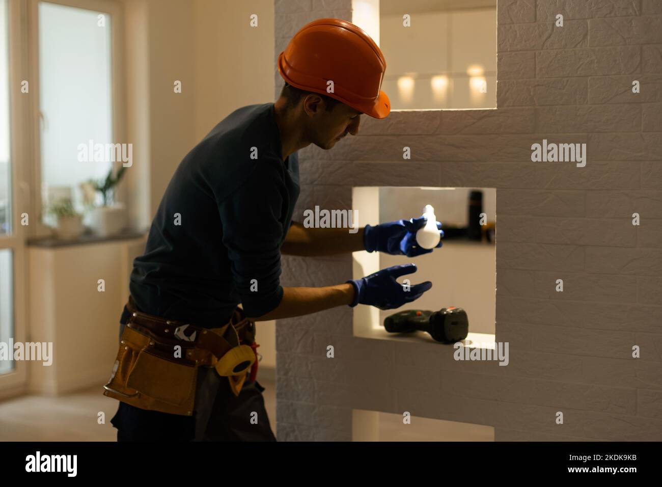 Electrician installs switch socket hi-res stock photography and images ...
