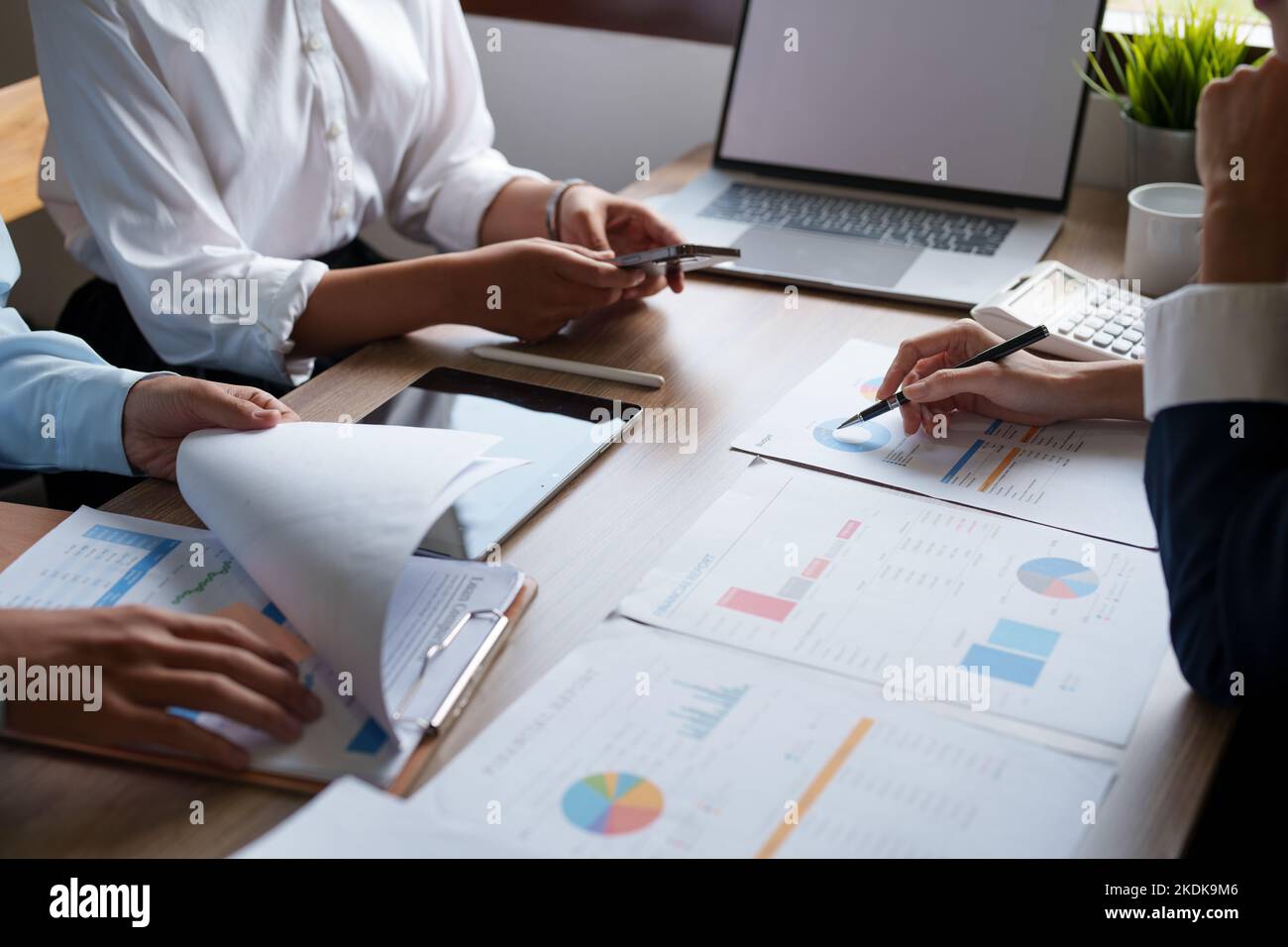 business people use documents and computers to analyze marketing Stock ...