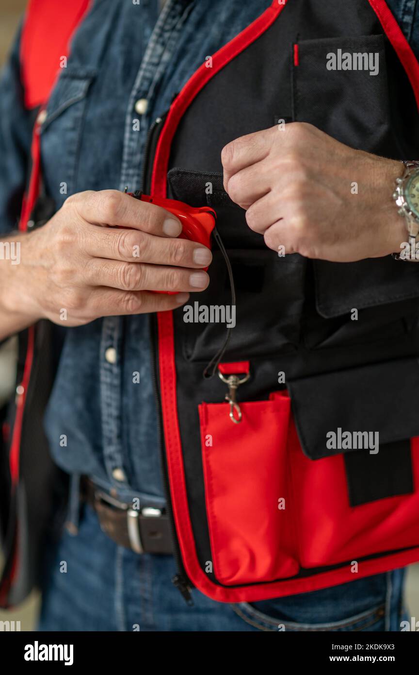 Close up picture of a man in a working vest Stock Photo - Alamy
